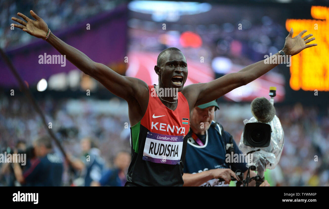 Kenya's David Lekuta Rudisha raises his arms in jubilation as he wins ...