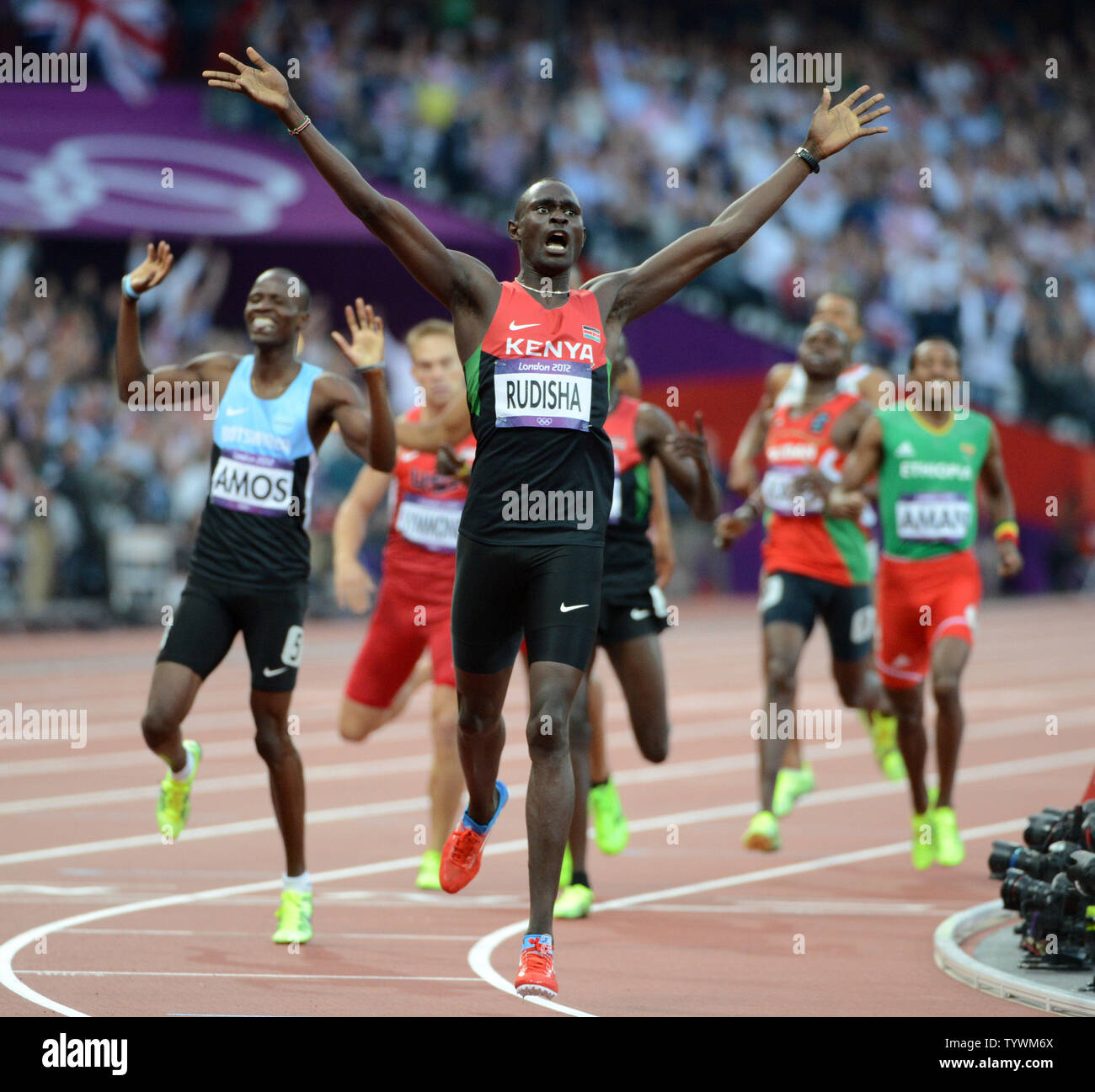 Kenya's David Lekuta Rudisha raises his arms in jubilation as he wins ...