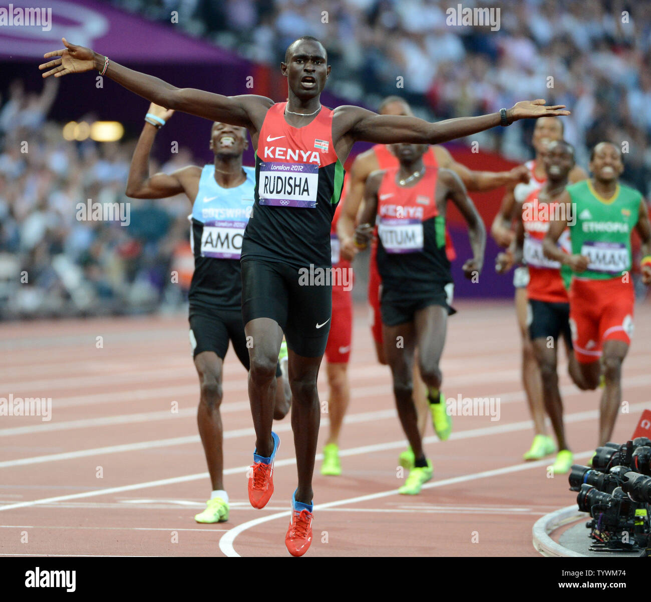 Kenya's David Lekuta Rudisha raises his arms in jubilation as he wins ...