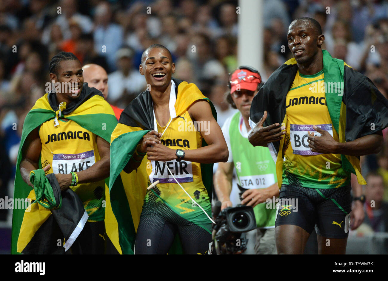 Jamaica's Usain Bolt celebrates with teammates Yohan Blake (L) and ...