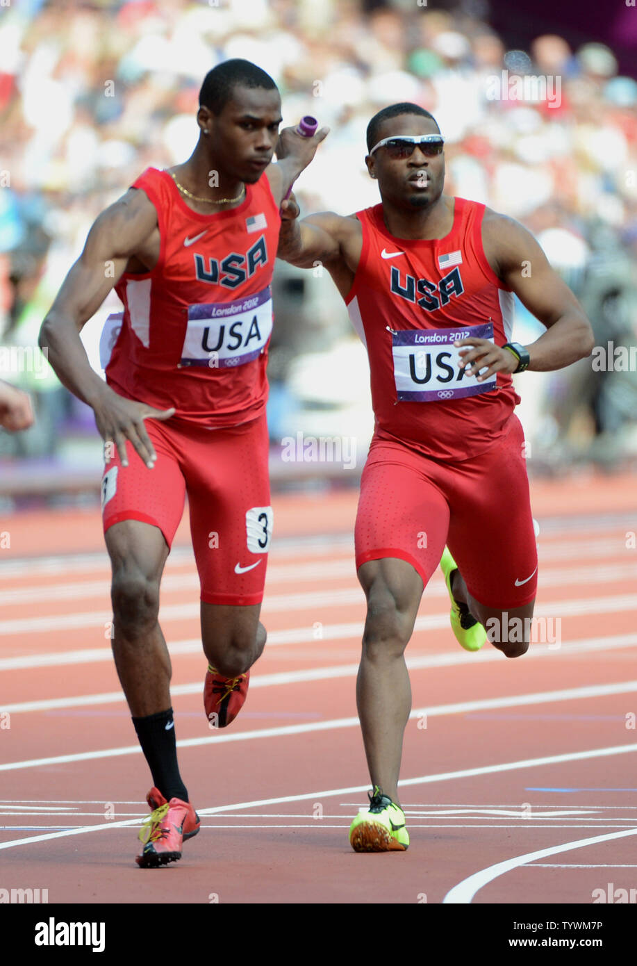 USA's Manteo Mitchell (R) hands off to teammate Joshua Mance during the ...