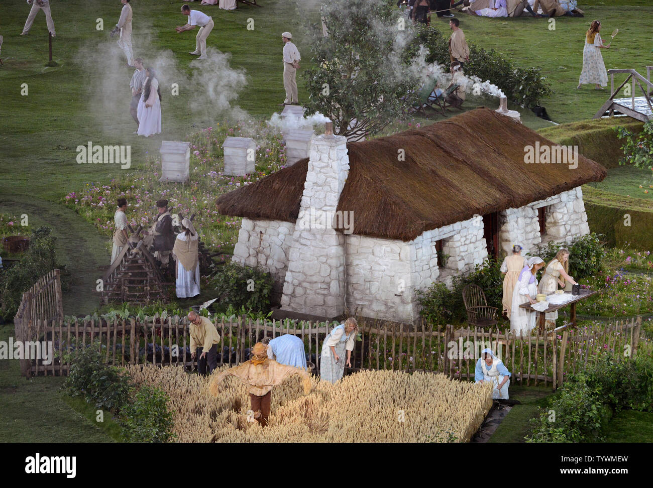 Actors depict a traditional English farm scene during the Opening ...