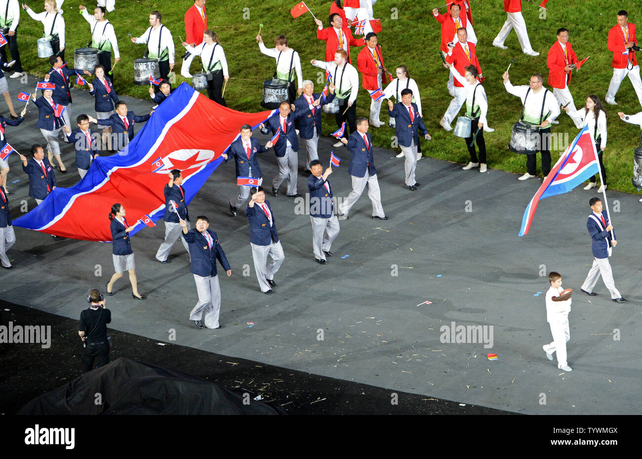 Pak Song-Chol carries the Democratic People's Republic of Korea's flag ...