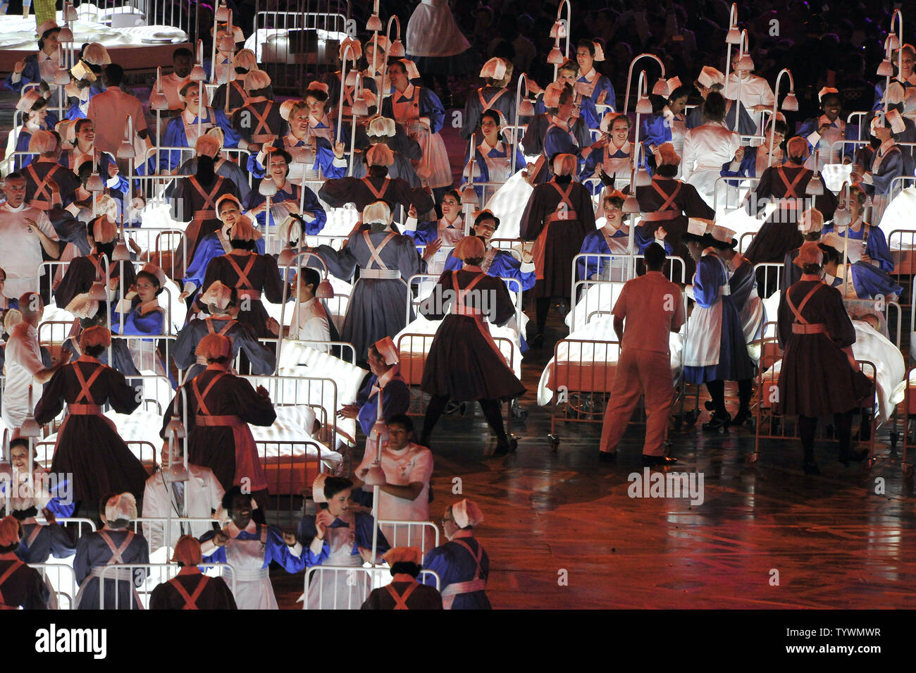 Performers dressed as doctors, nurses and sick children perform in ...