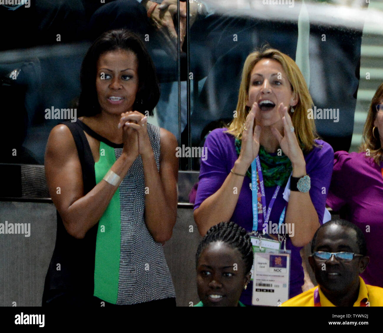 United States first lady Michelle Obama cheers on the USA team in the ...