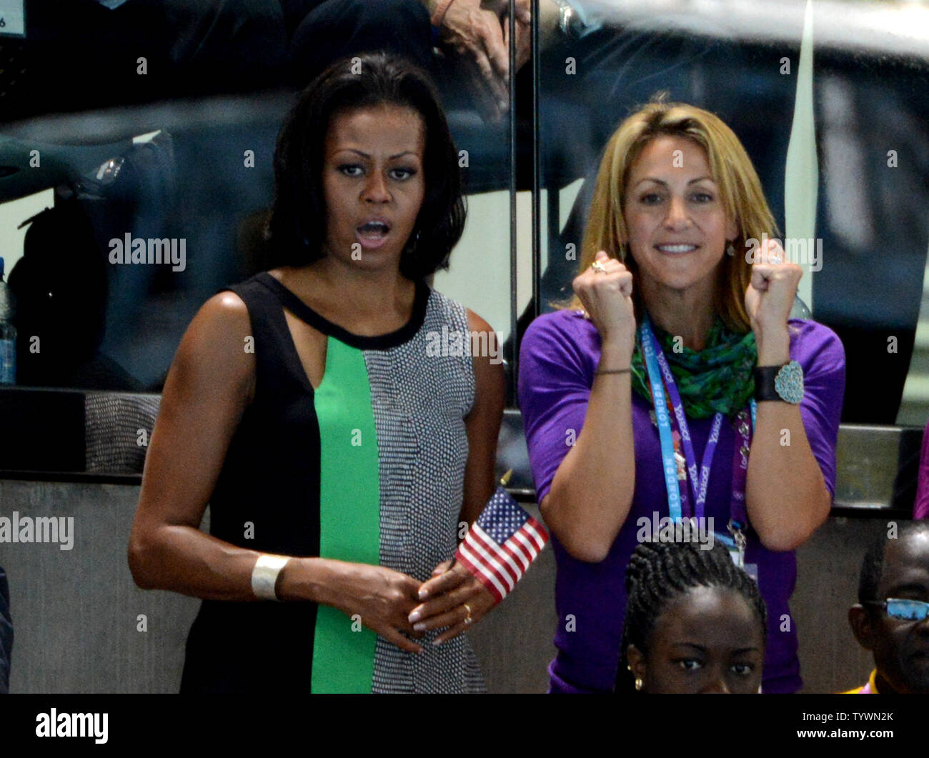 United States first lady Michelle Obama cheers on the USA team in the ...