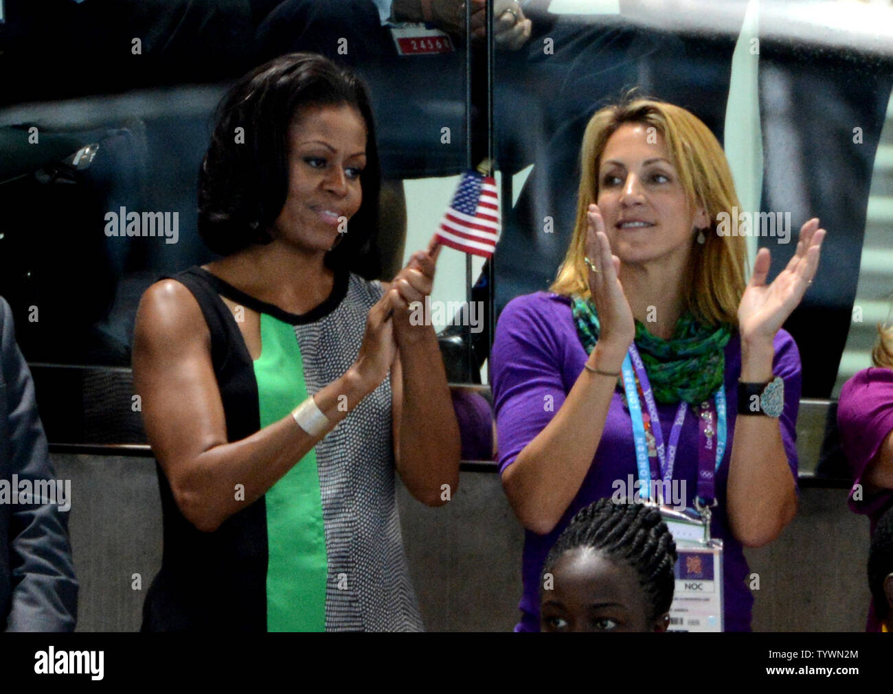 United States first lady Michelle Obama cheers on the USA team in the ...