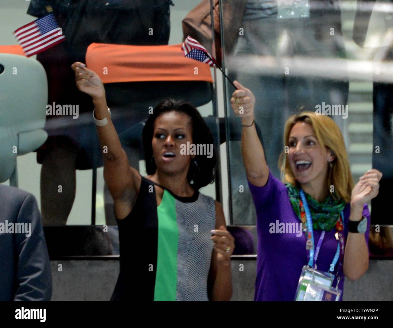 United States first lady Michelle Obama cheers on the USA team in the ...
