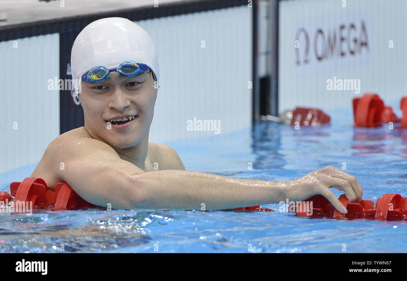 Sun Yang of China rests in the pool after finishing his heat in the Men ...