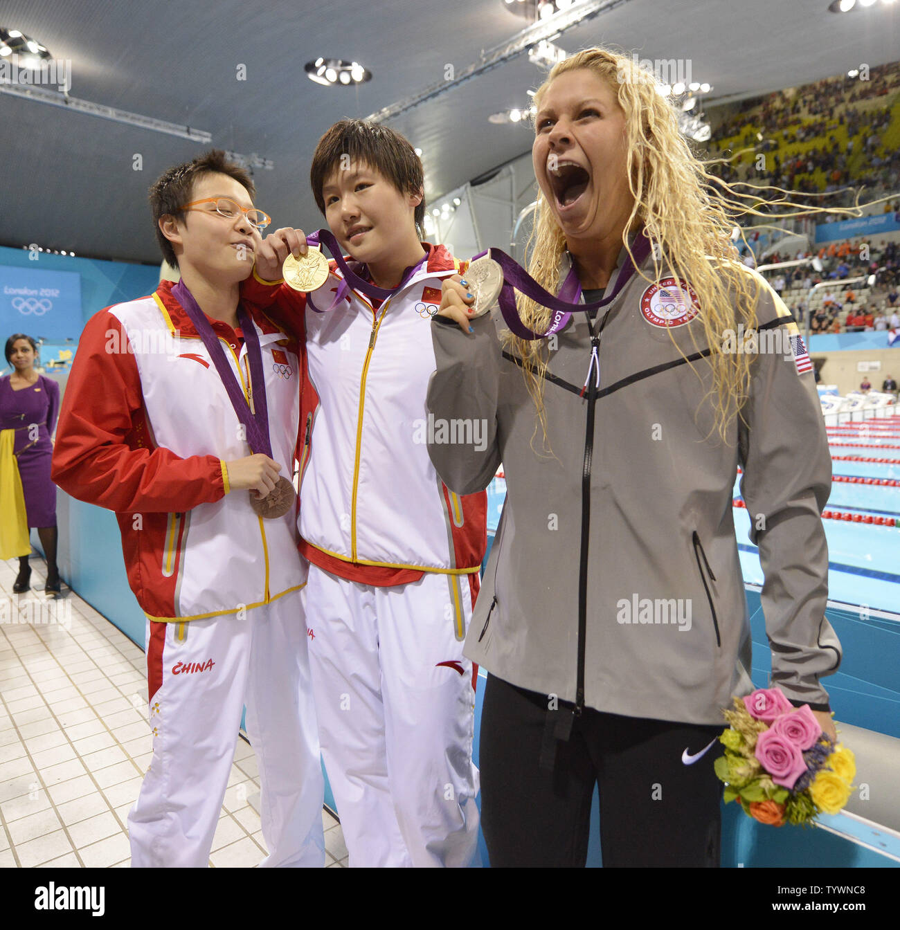 Bronze Medalist Li Xuanxu (L-R) of China, Gold Medalist Ye Shiwen of ...