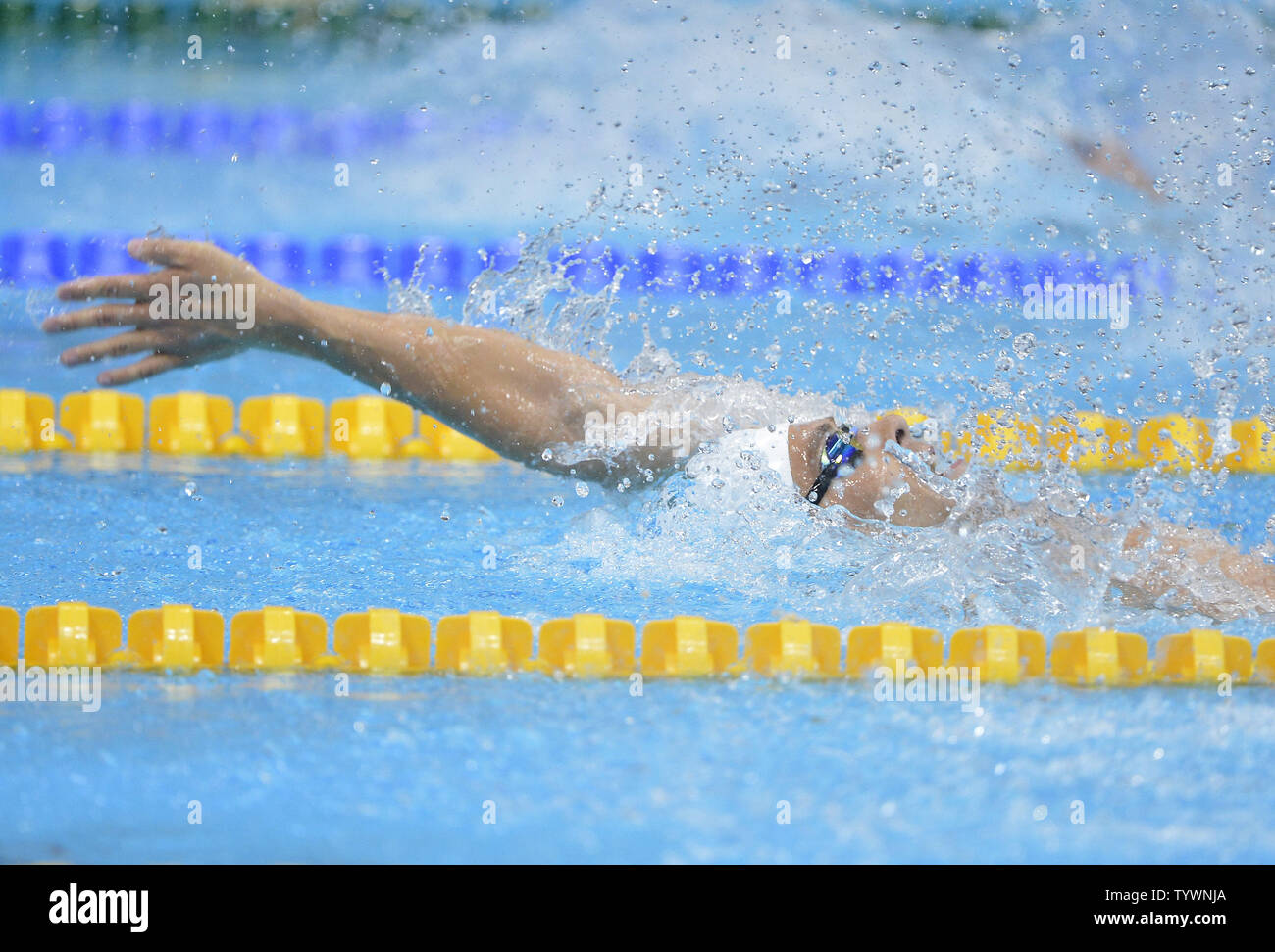 Nick Thoman of the United States swims his heat in the Men's 100M ...