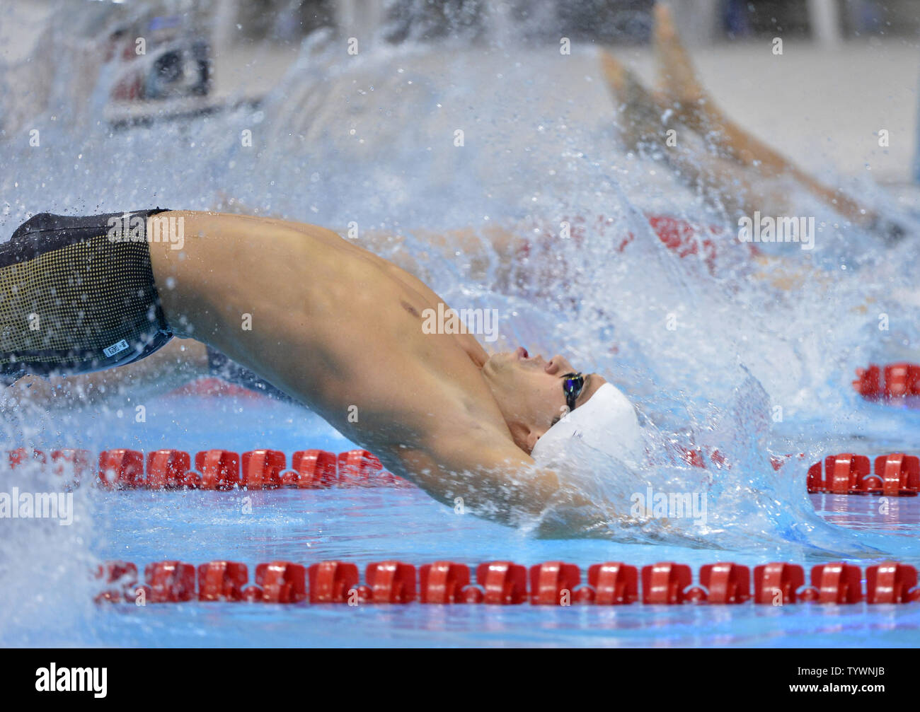 Matthew Grevers of the United States dives in to begin his heat in the ...