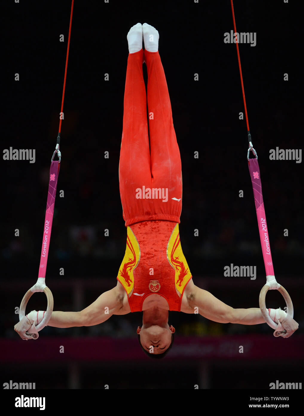 China's Chen Yibing goes through his routine on the Rings at the Men's Gymnastics Team Final ...