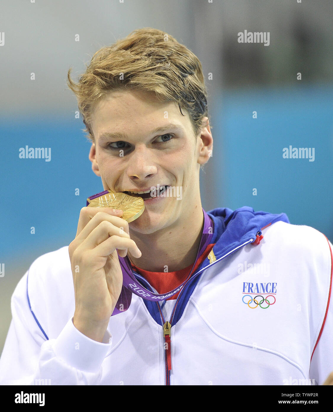 Yannick Agnel Of France Bites His Gold Medal After In The Mens 200m