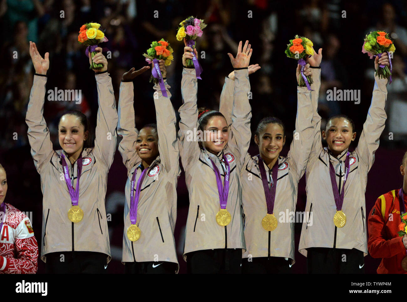The United States Gymnastics team is all smiles as they wear their Gold ...
