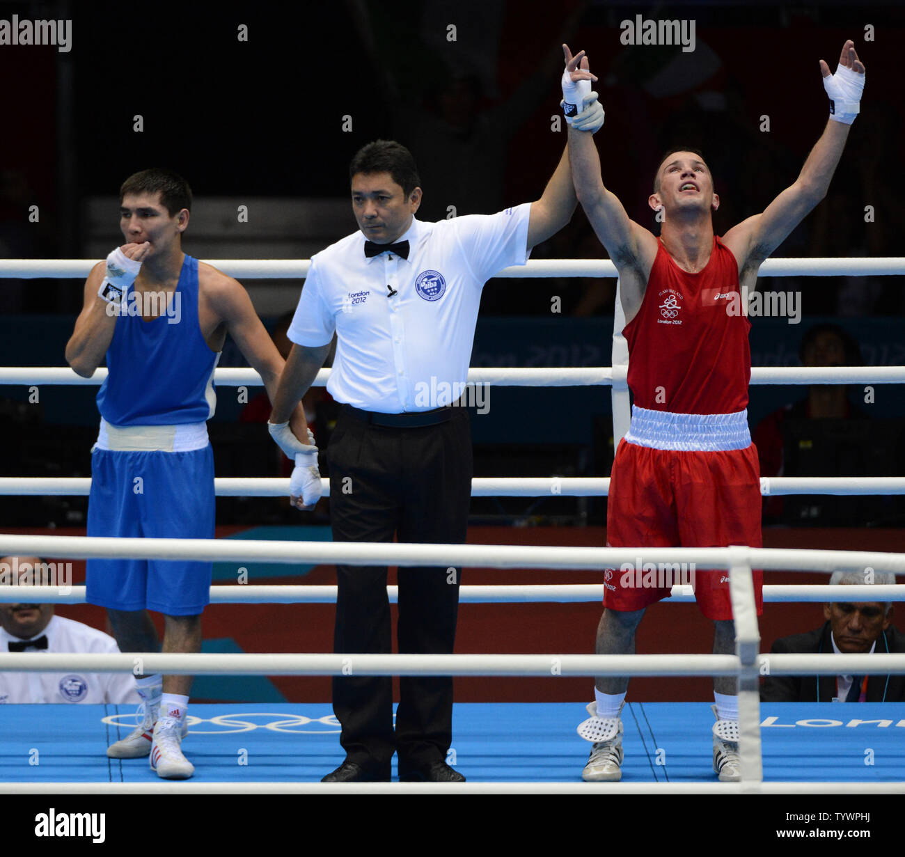 John Joe Nevin of Ireland (R) is declared the winner over Kanat ...