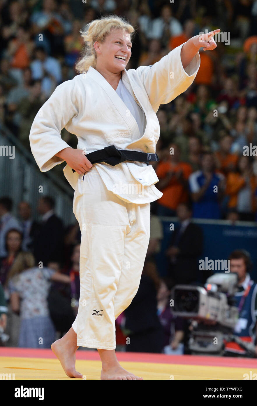 Kayla Harrison of the USA (white) celebrates defeating Gemma Gibbons of ...