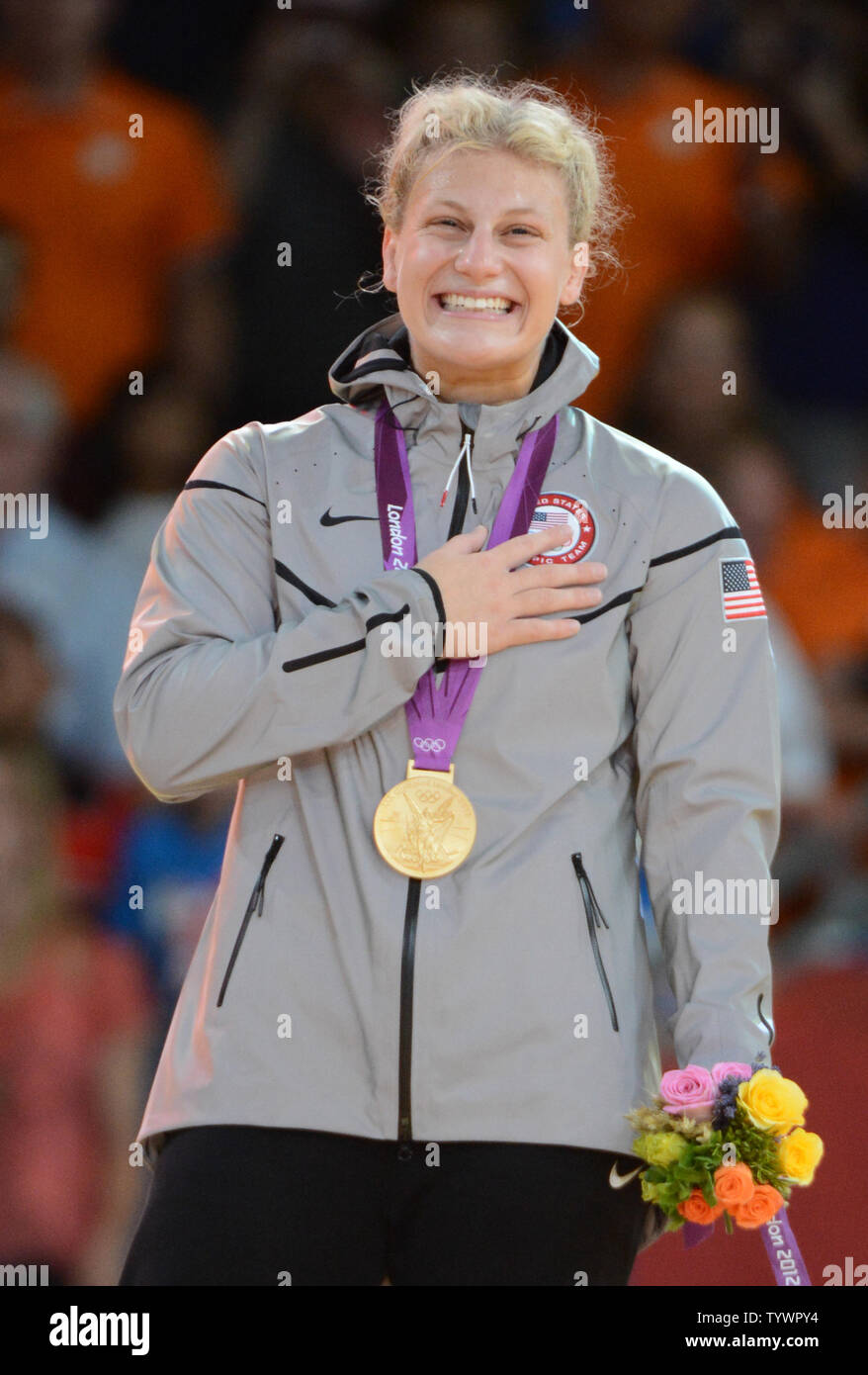 Kayla Harrison of the USA stands on the podium after winning the gold ...