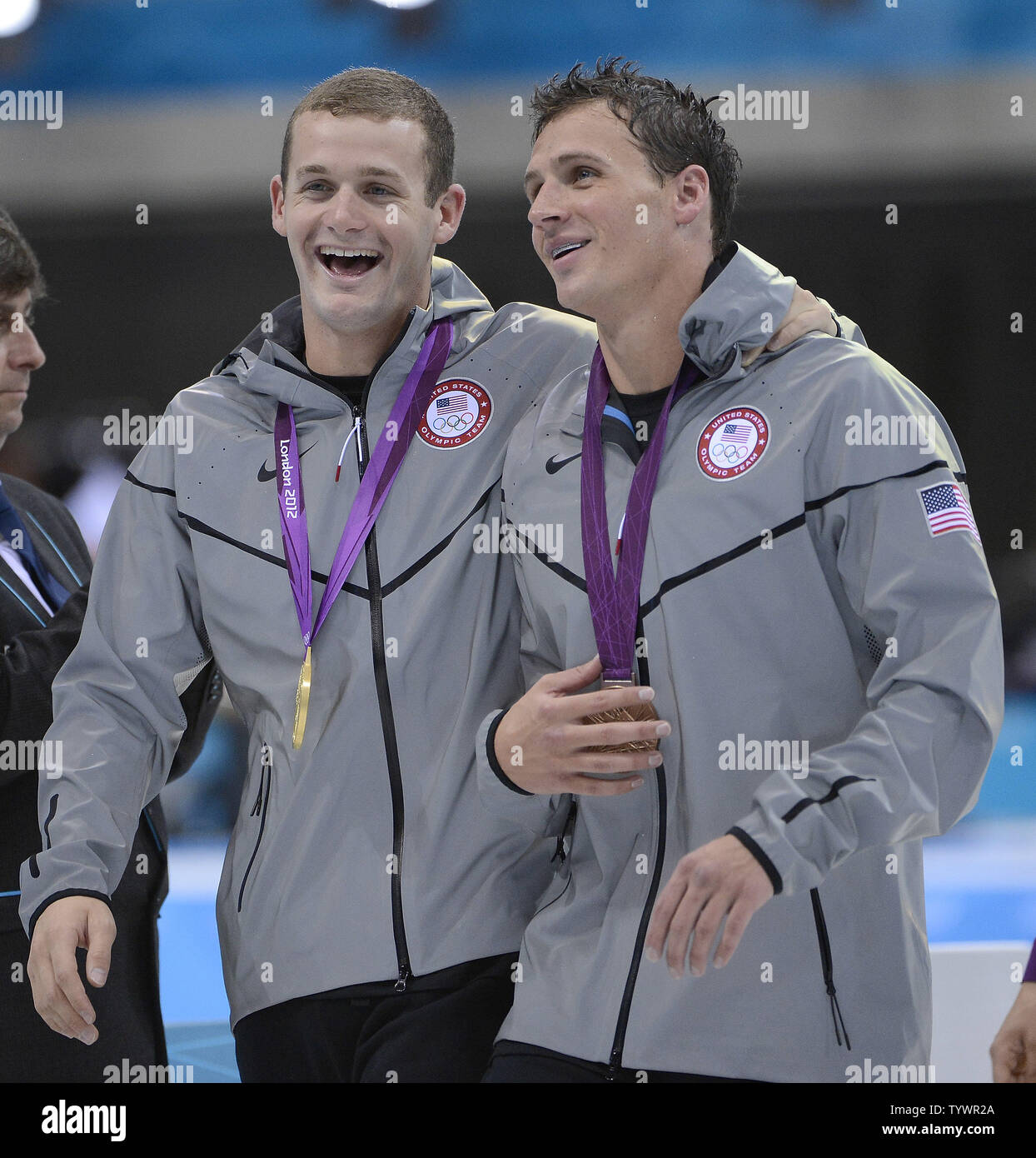 Gold Medalist Tyler Clary of the United States (L) puts his arm around ...