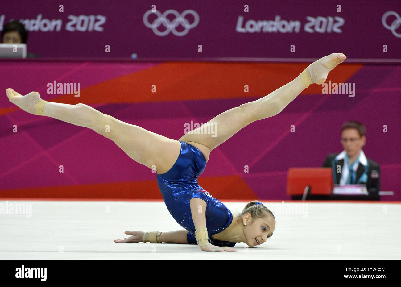 Russian Gymnast Victoria Komova Goes Through Her Routine On The Floor