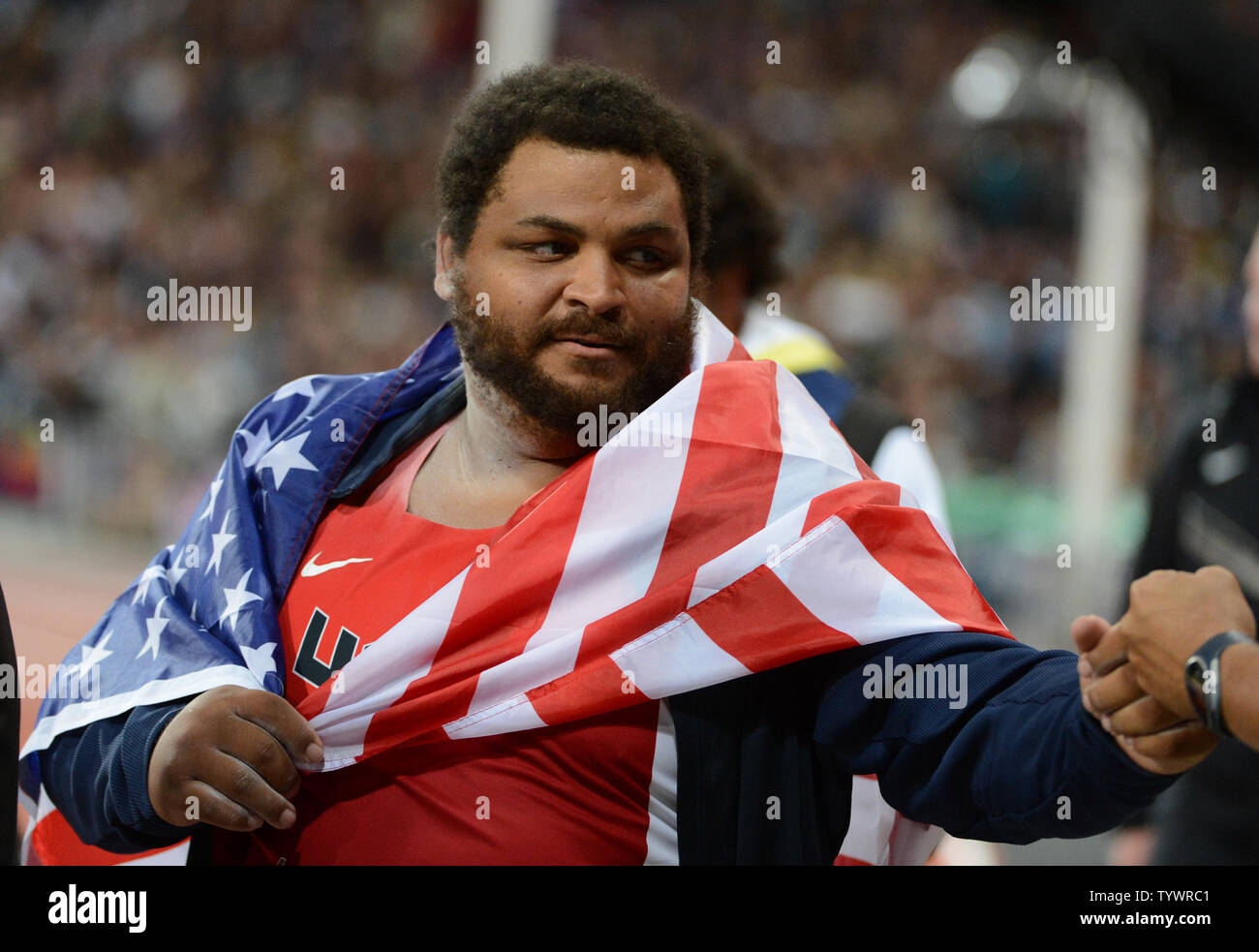 Reese Hoffa of the USA is congratulated after winning the bronze in Men ...