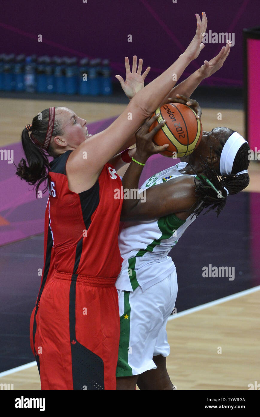 Canada's Krista Phillips (L) blocks Brazil's Clarissa Santos' path to ...