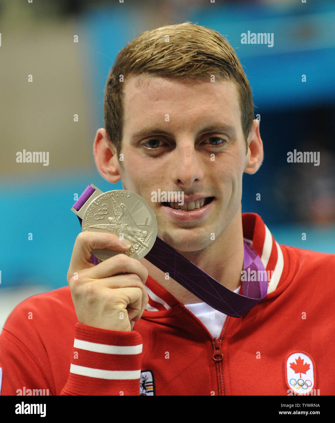 Canada's Ryan Cochrane smiles as he shows his silver medal during the ...