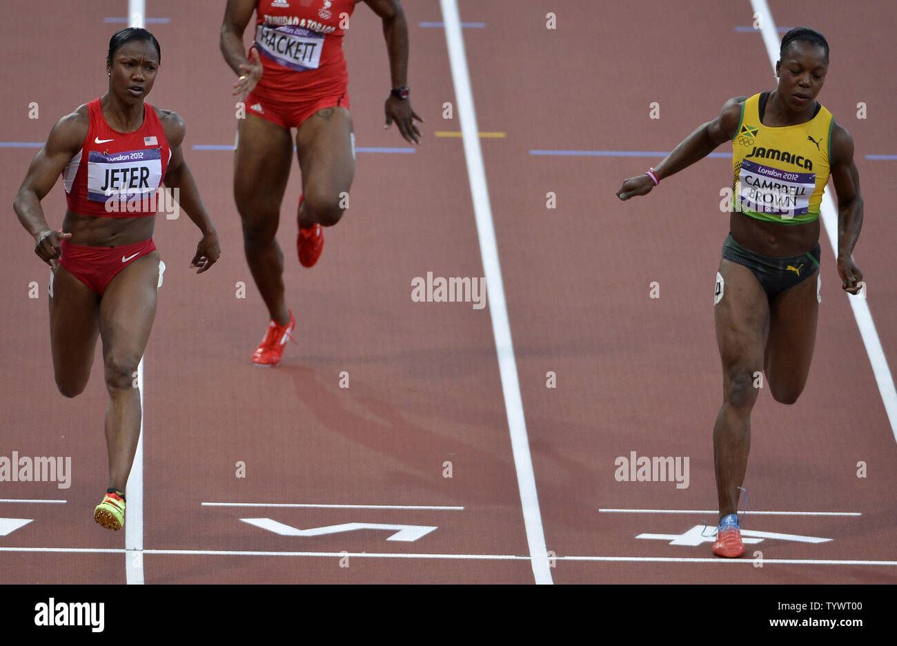 American sprinter Carmelita Jeter (L) wins her Women's 100m semifinal ...
