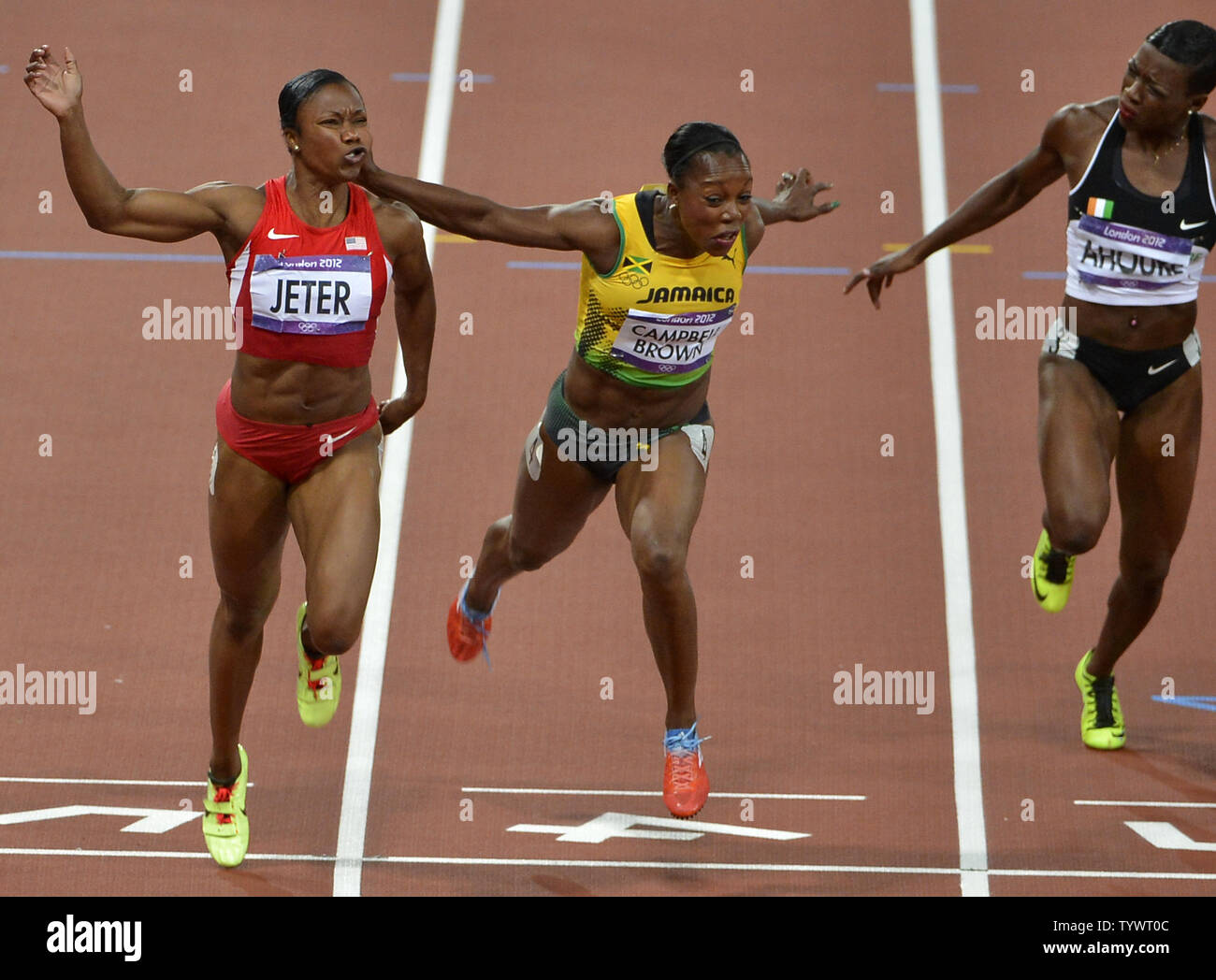 American sprinter Carmelita Jeter (L) wins the silver medal by ...