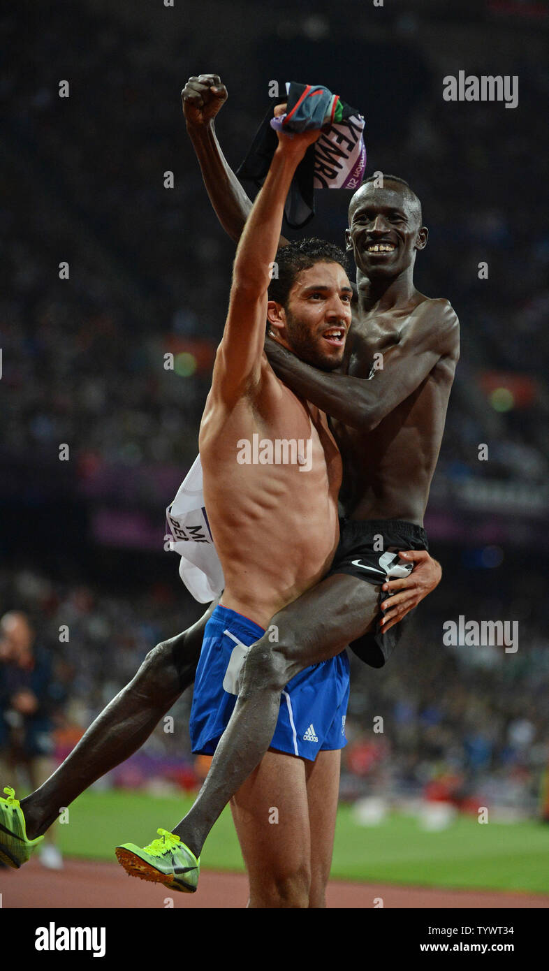 Gold medal winner Ezekiel Kemboi of Kenya (R) is lifted by silver medal ...