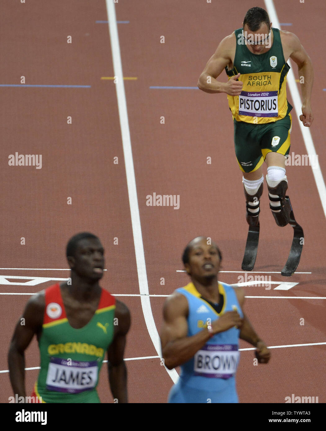 South African sprinter Oscar Pistorius (R) finishes in last place in a ...