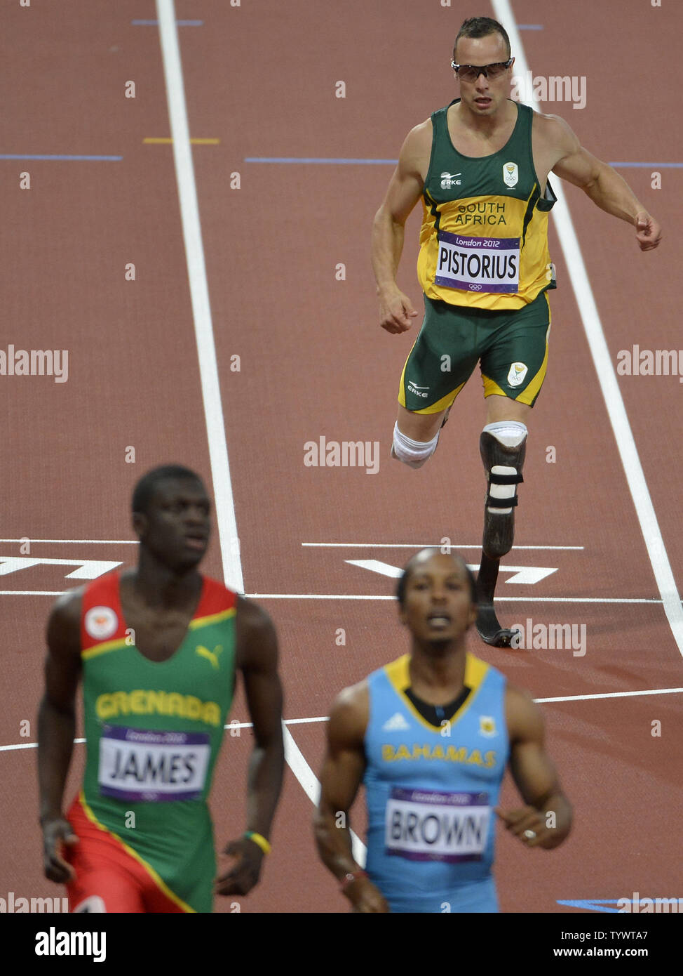 South African sprinter Oscar Pistorius (R) finishes in last place in a ...
