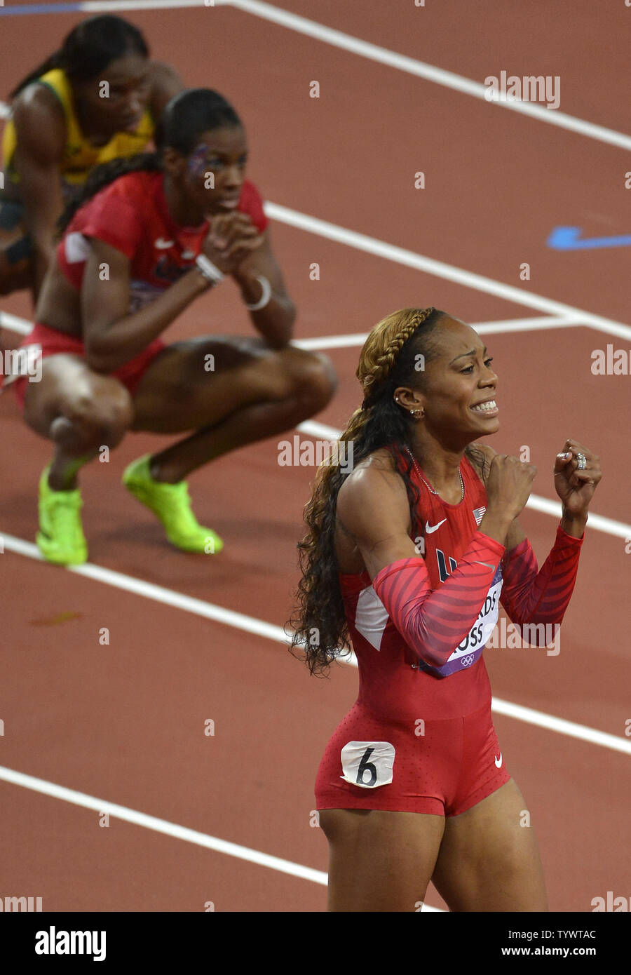 American sprinter Sanya Richards-Ross raises her arms in jubilation ...