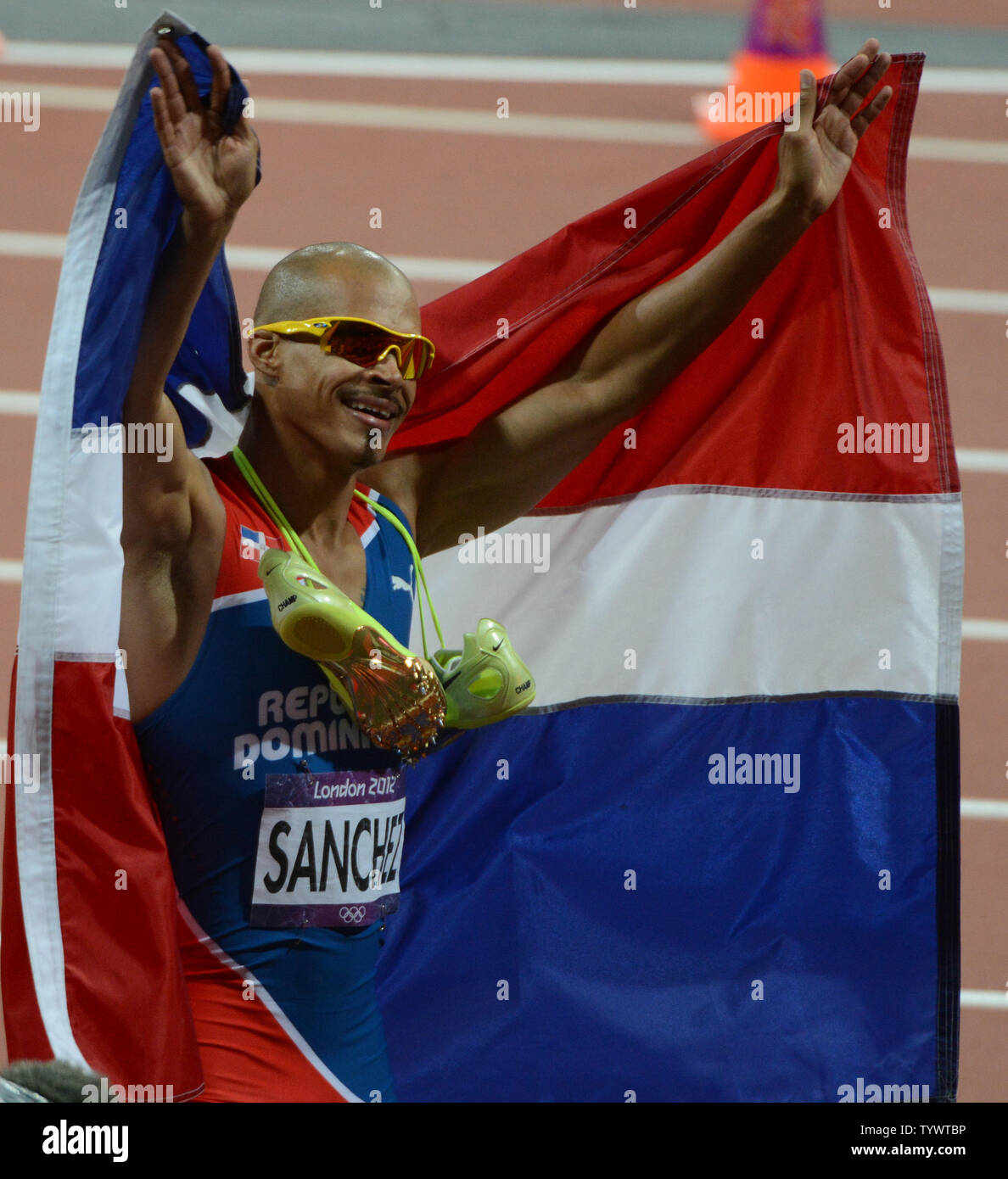 Felix Sanchez of the Dominican Republic celebrates winning the Gold in ...