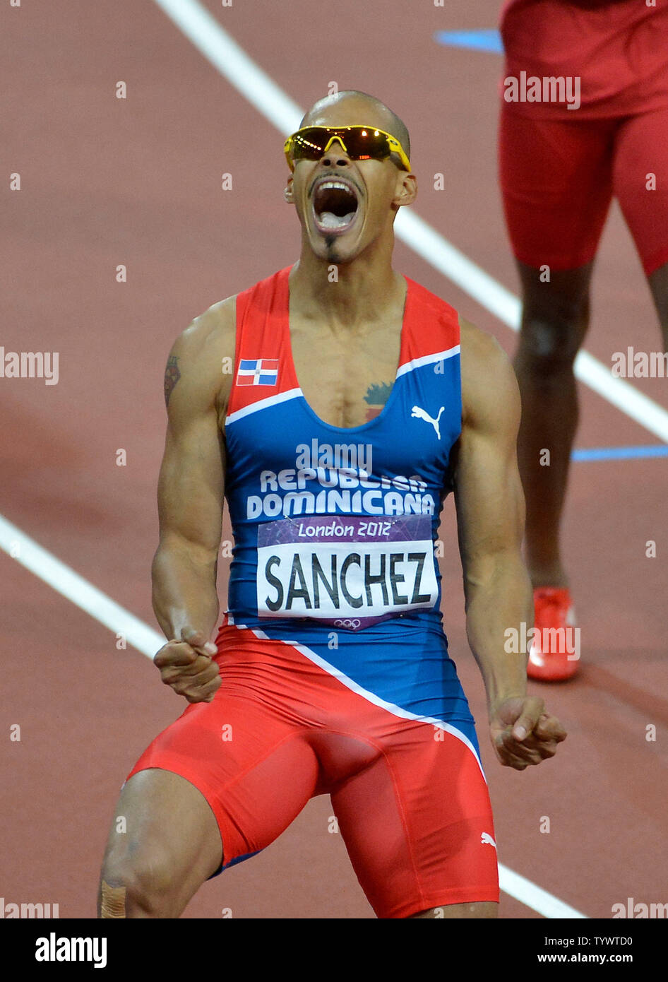 Felix Sanchez of the Dominican Republic reacts after winning the Gold ...
