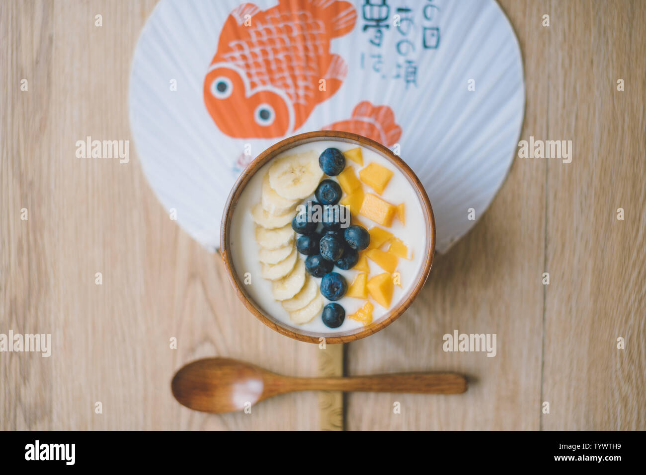 Healthy fruit yogurt with fan Stock Photo - Alamy