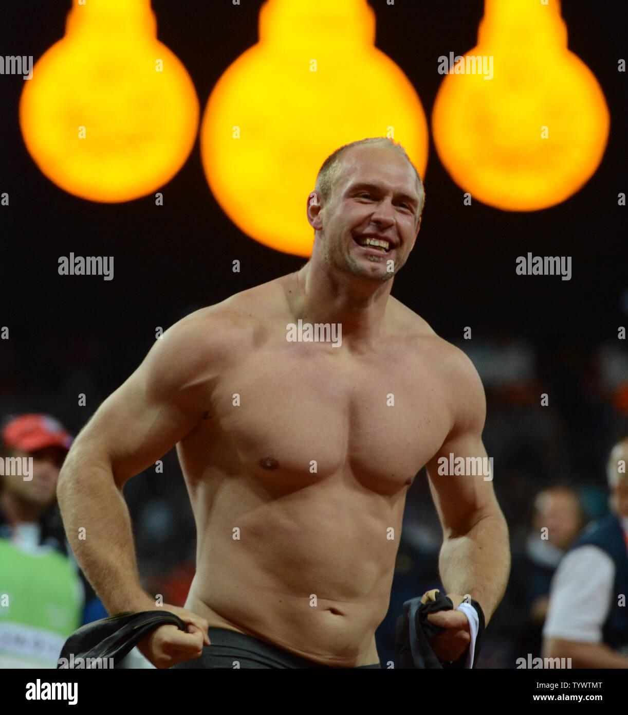 Robert Harting of Germany celebrates winning gold in the Men's Discus ...