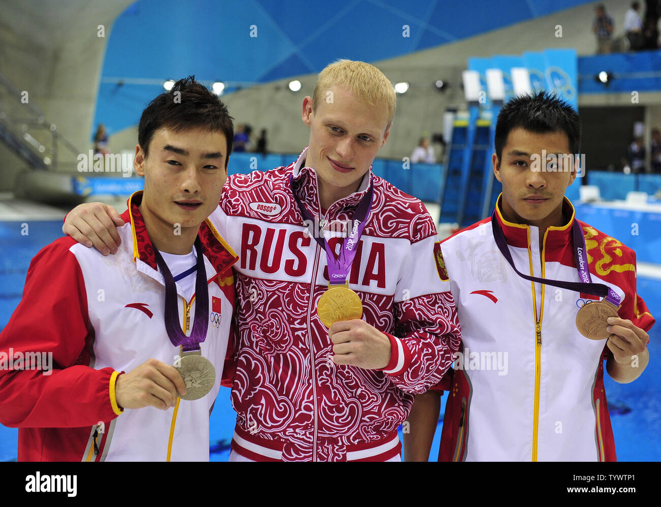 Medalists in the Men's 3m Springboard Diving competition show off their ...