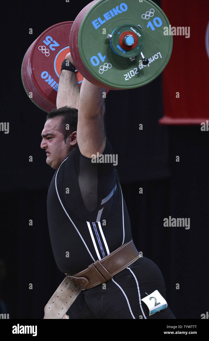 Iranian weightlifter Behdad Salimkordasiabi makes a successful lift as ...