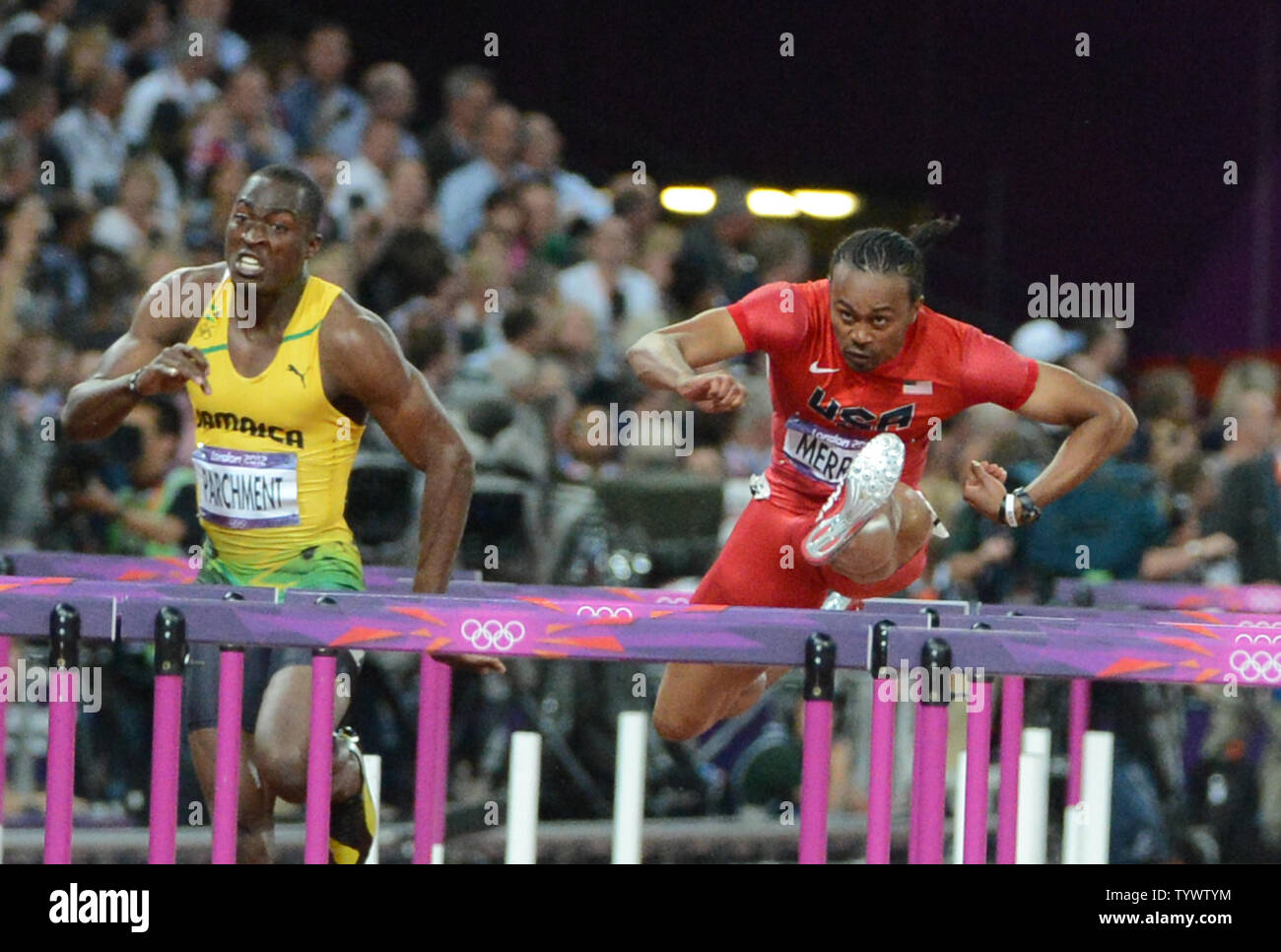 Aries Merritt of the USA (R) wins the gold medal in Men's 110M Hurdles ...