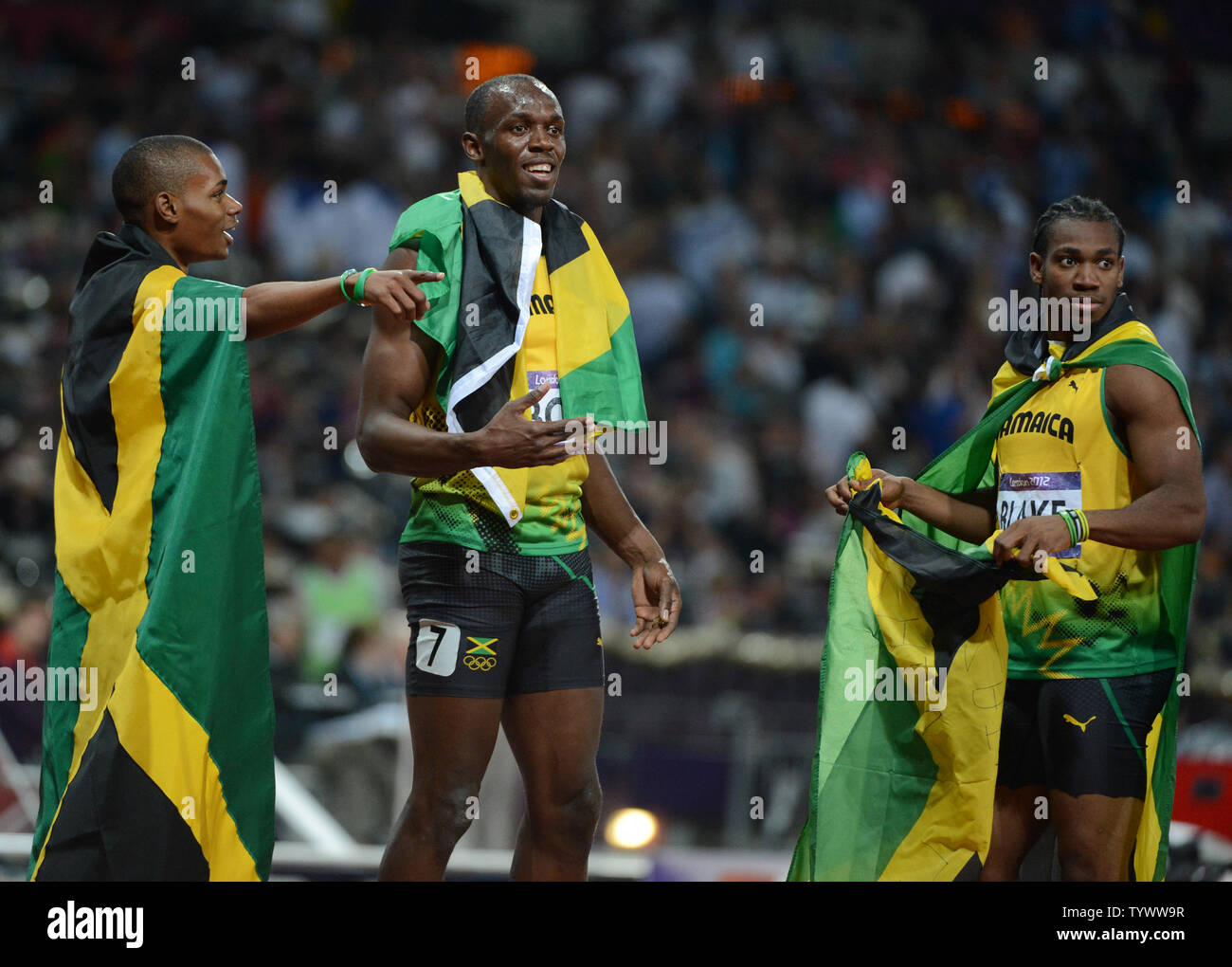 Gold medal winner Usain Bolt (C) celebrates with bronze medalist warren ...