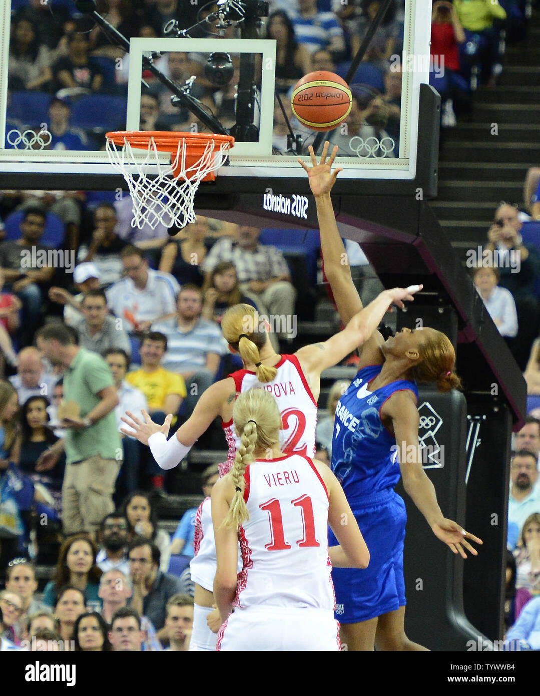 Center Sandrine Gruda (7) of France scores over center Irina Osipova ...