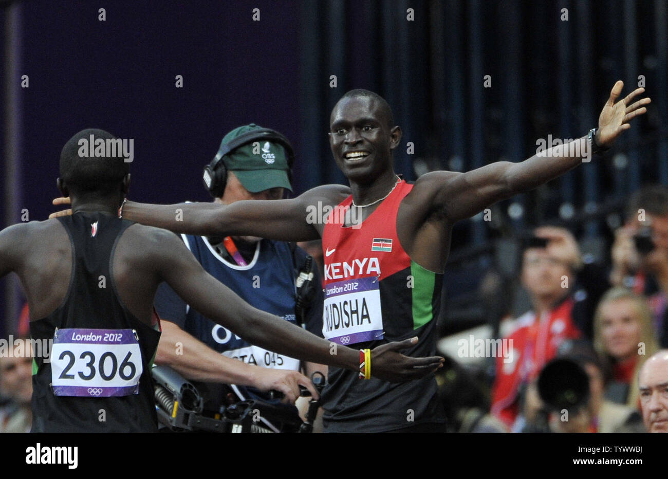 David Lekuta Rudisha of Kenya (R) hugs teammate Timothy Kitum after ...