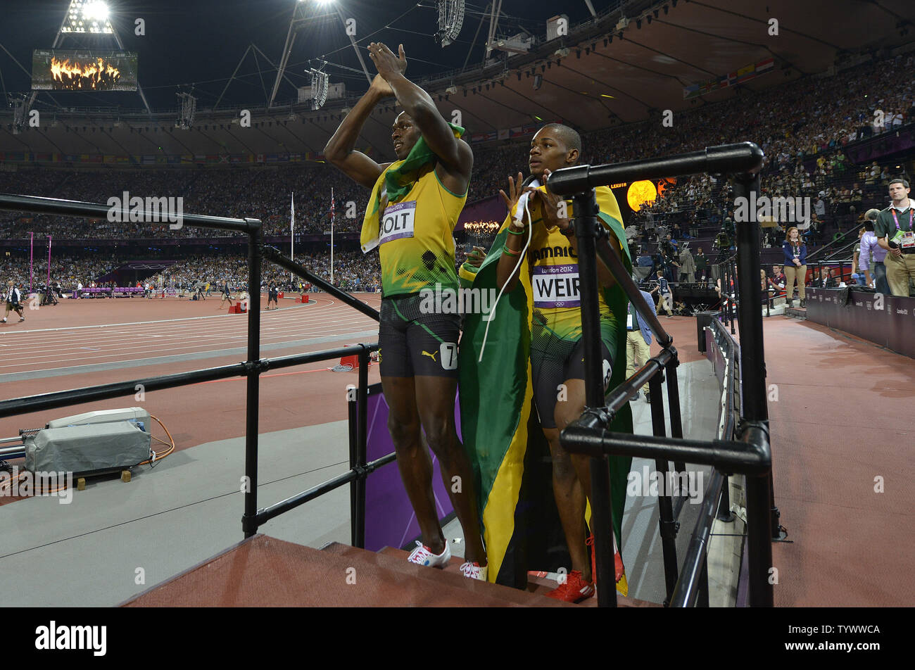 Gold Medalist Usain Bolt (L) and Bronze Medalist Warren Weir, both of ...