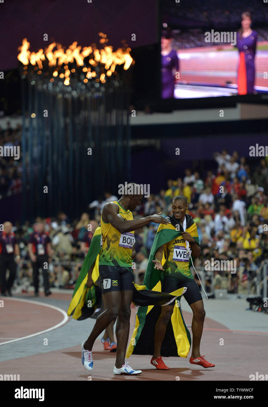 Usain Bolt of Jamaica (L) and teammate Warren Weir won medals in the ...