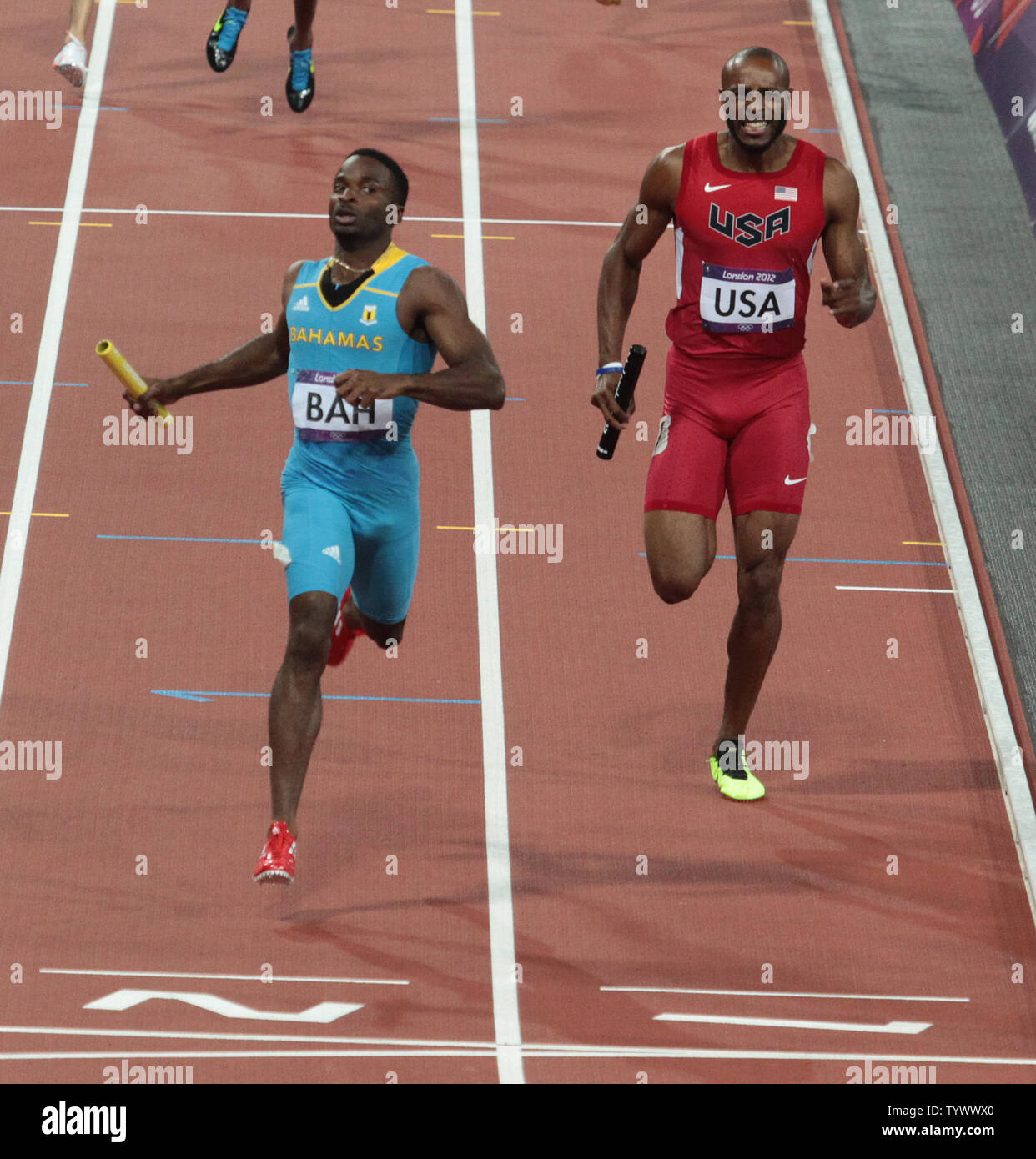 Bahama's Ramon Miller (L) celebrates his team's victory in the Men's ...
