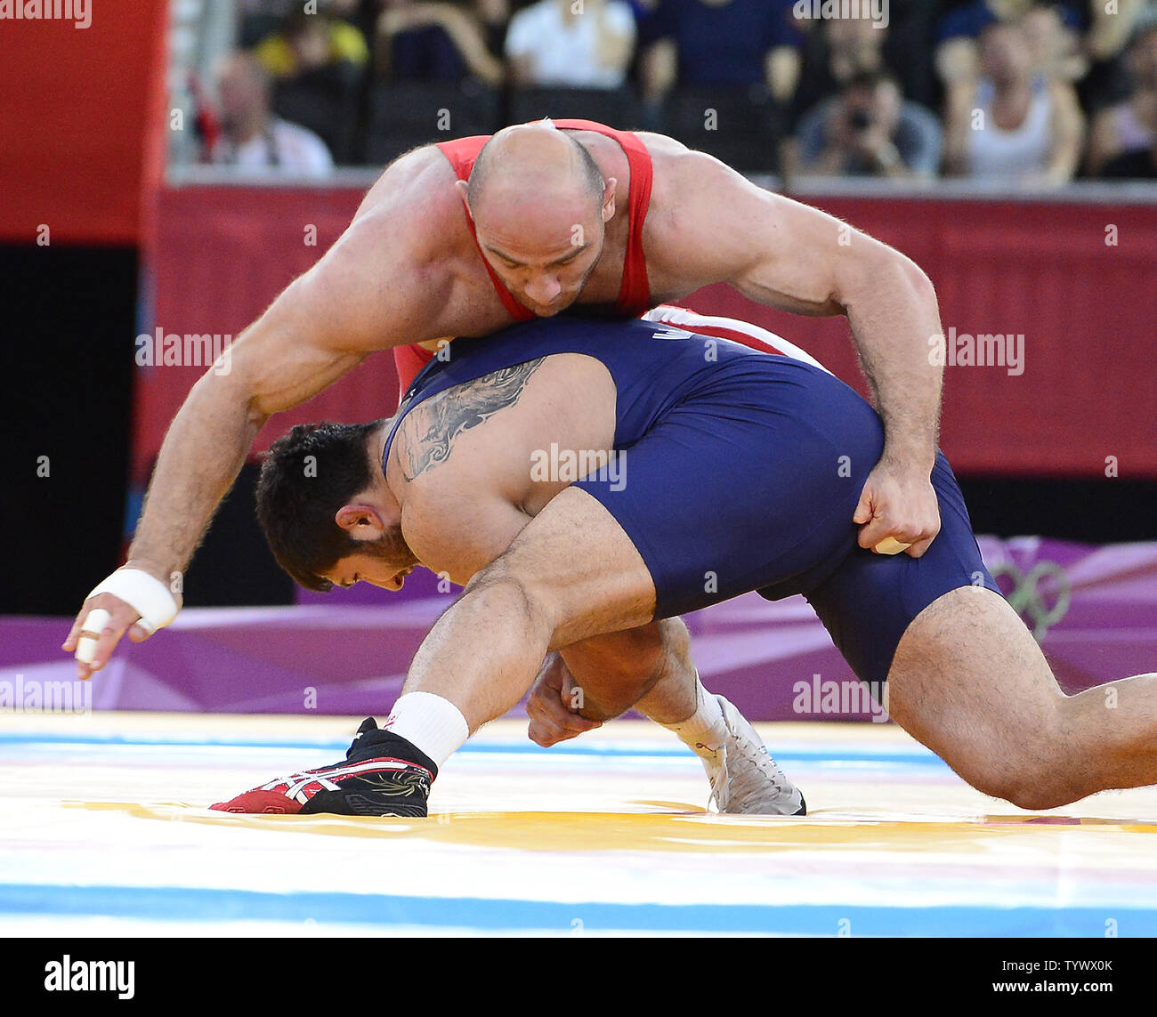 Davit Modzmanashvili of Georgia, bottom, and Artur Taymazov of ...