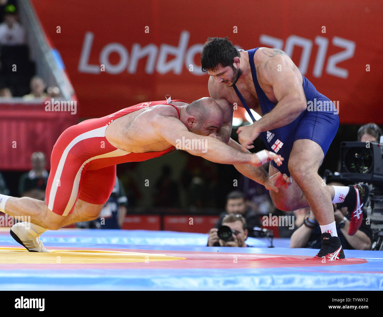 Davit Modzmanashvili of Georgia, right, and Artur Taymazov of ...
