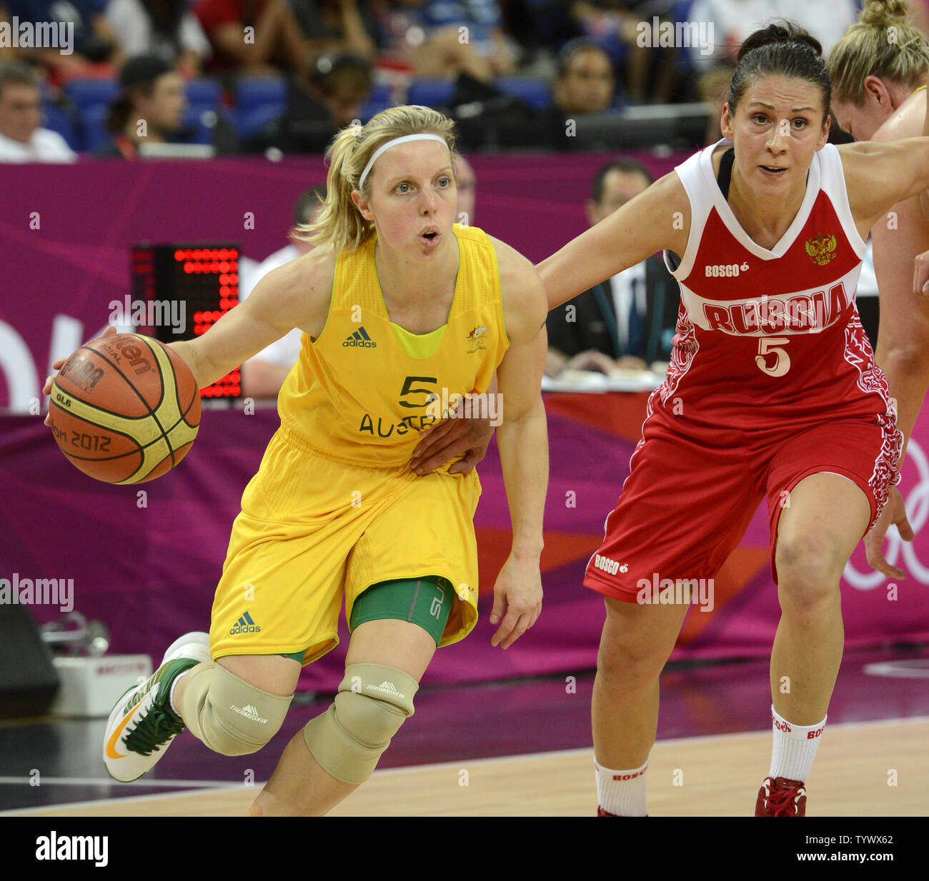 Australia's Samantha Richards (L) dribbles past Russian defender ...