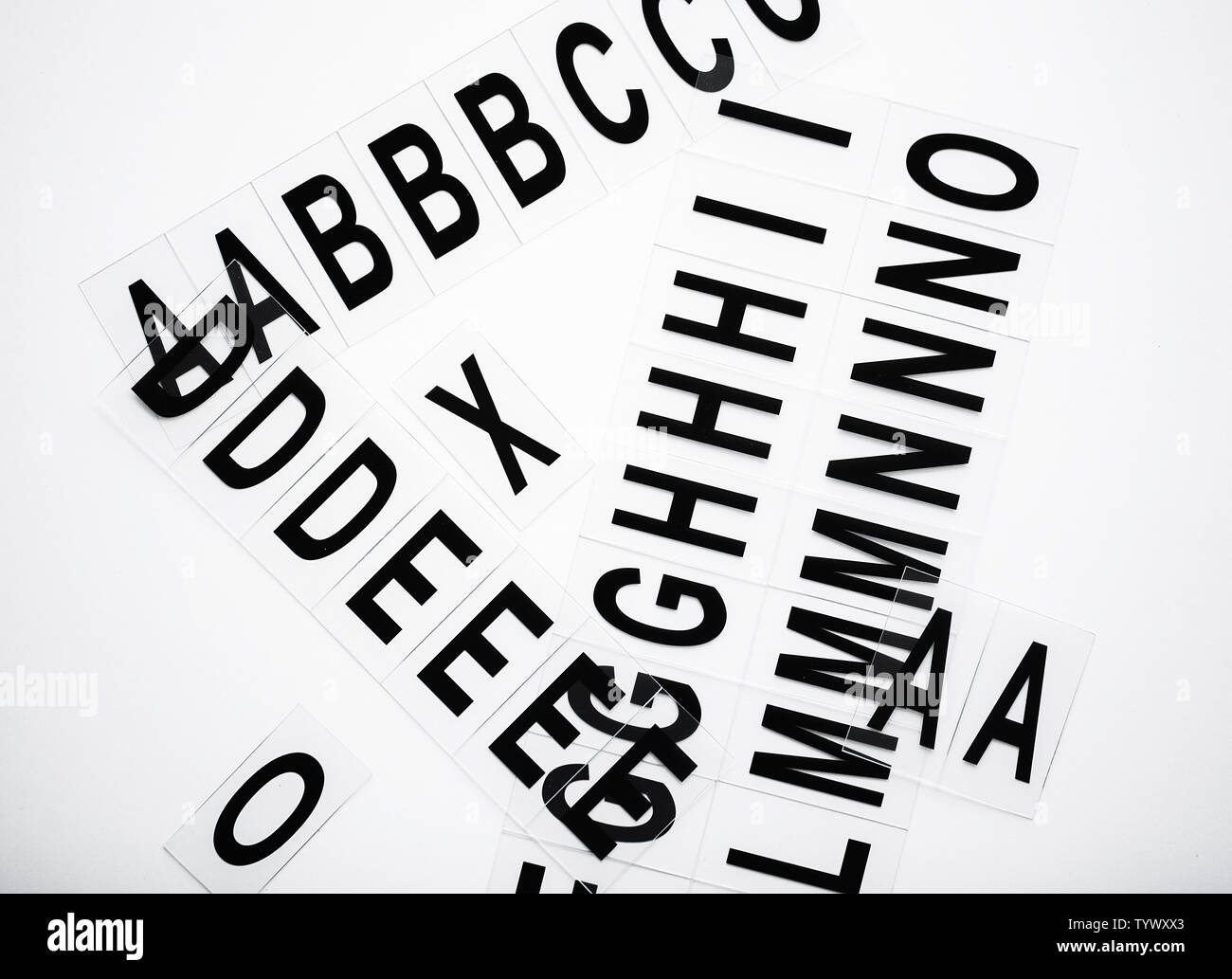 Black capitalize letter on white table background Stock Photo - Alamy